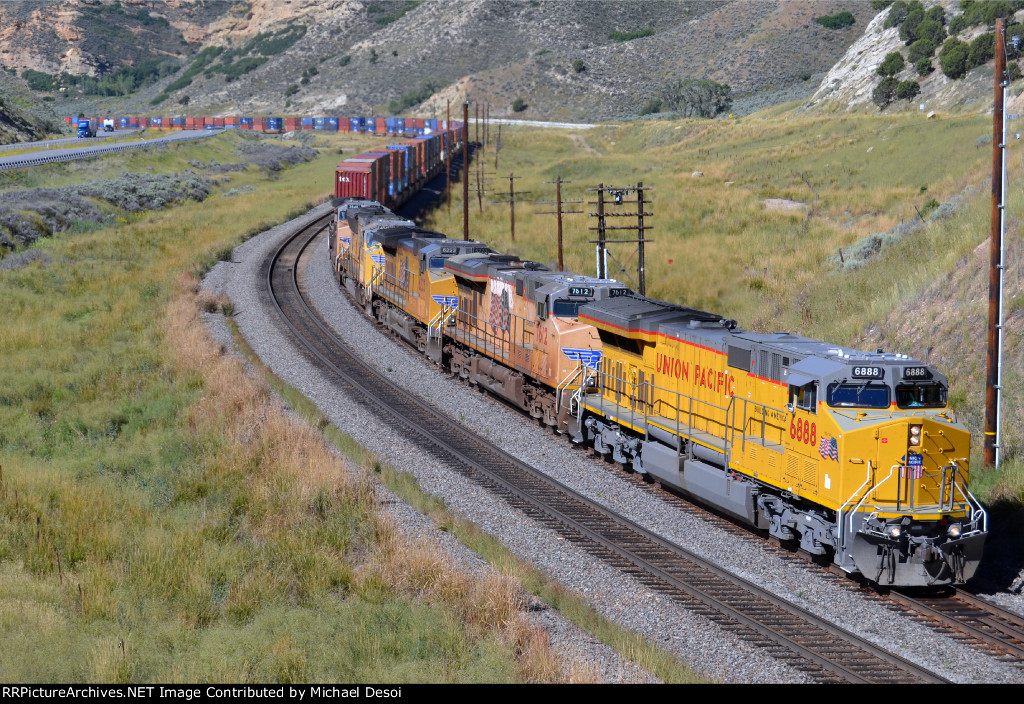 UP 6888 7612 6223 4846 5848 (C44ACM, C45ACCTE, C44ACM, SD70M, C44ACCTE) lead an eastbound stack ...